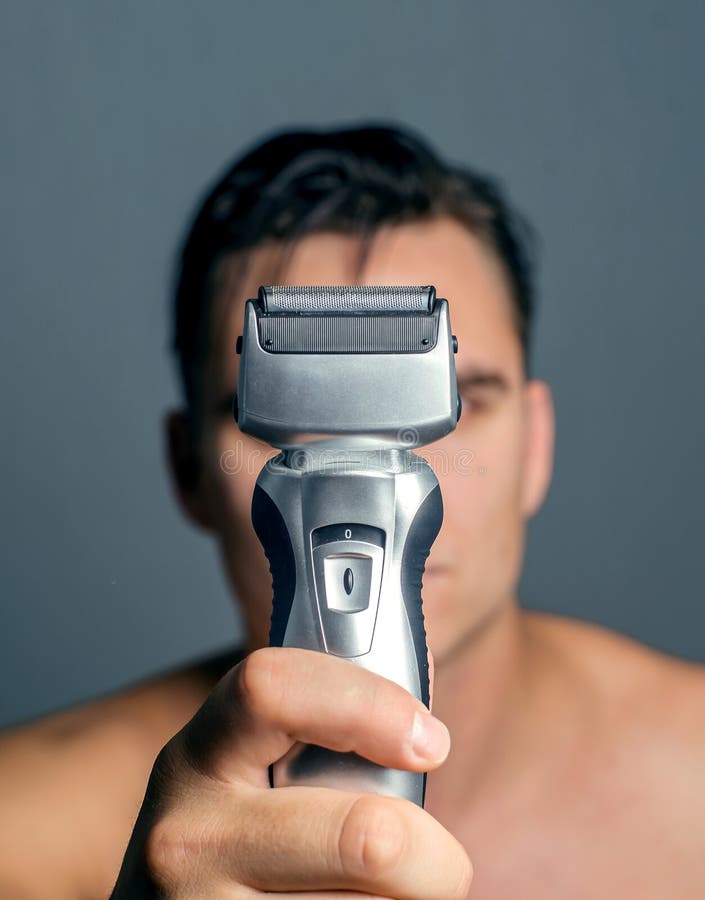 Hand Holding an Electric Shaver Stock Image - Image of hygiene, razor ...