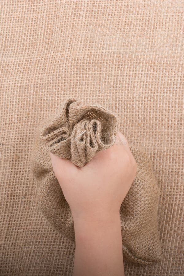 Hand Holding Empty Little Sack Made of Linen Stock Image - Image of ...