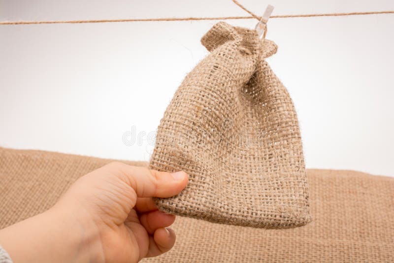 Hand Holding Empty Little Sack Made of Linen Stock Photo - Image of ...