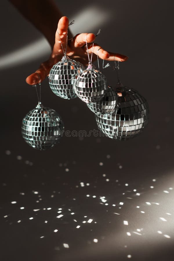 The Hand is Holding Few Little Disco Balls Stock Image - Image of light ...