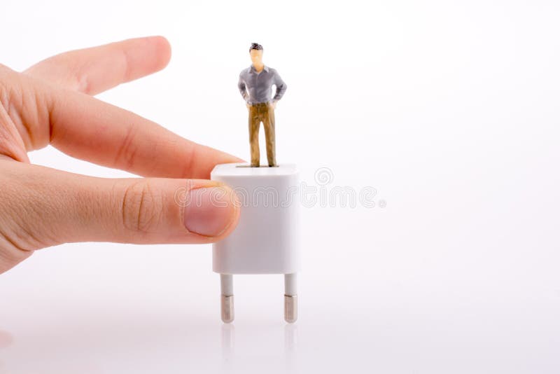 Hand Holding a Figure on an Adapter Stock Image - Image of electric ...