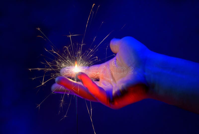 Hand Holding Fire Light Sparkler Stock Photo - Image of burning, faith ...