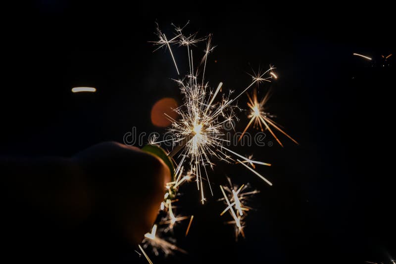 Hand Holding Firework Sparkle Exposed Texture in Celebrating Night ...