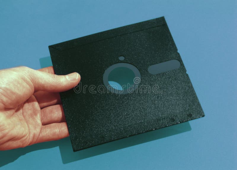 5.25 Inch Floppy Disk Hand Holding Stock Photo - Image of disk, vintage ...