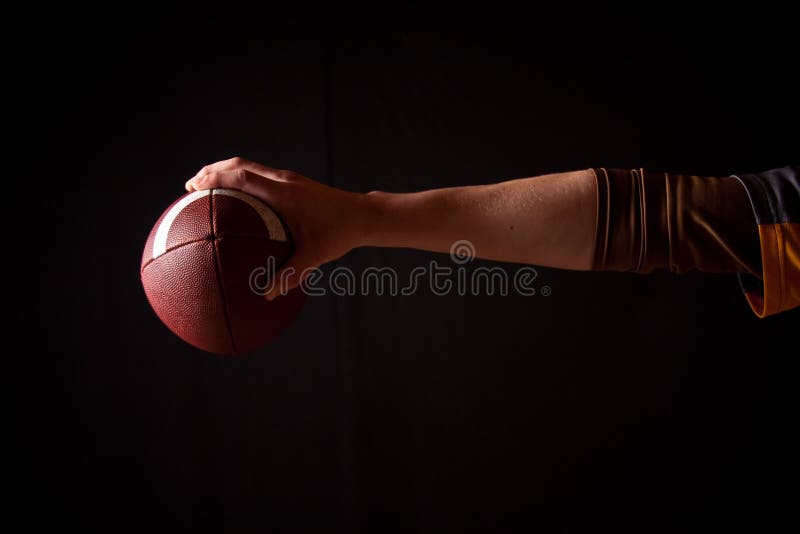 Hand Holding Football stock photo. Image of american - 13159458