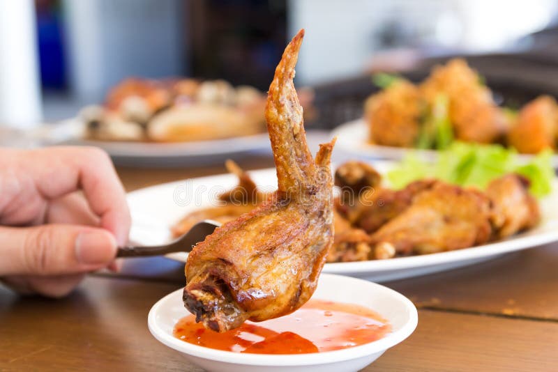 Hand Holding Fork Stabbing Fried Chicken Stock Photo - Image of lunch ...