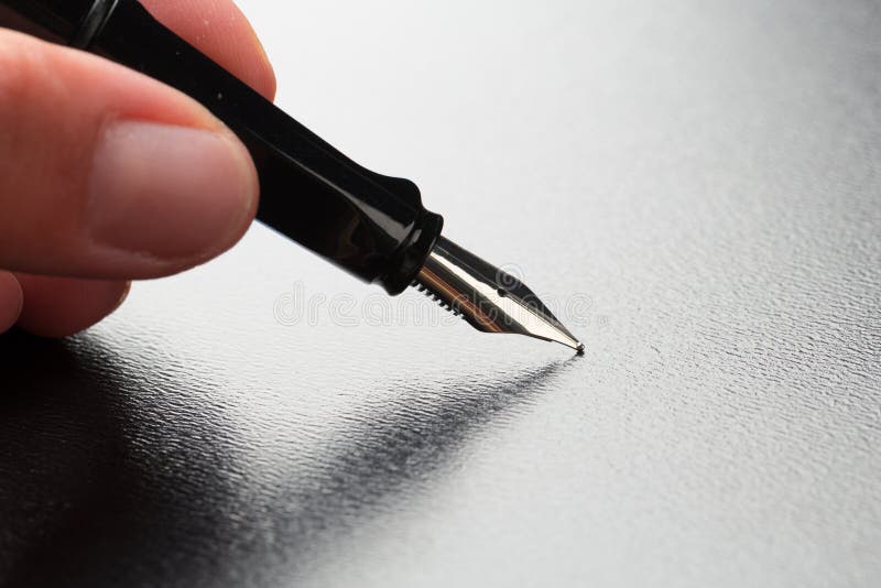 Hand Holding the Fountain Pen. Creative Photo. Stock Image - Image of ...