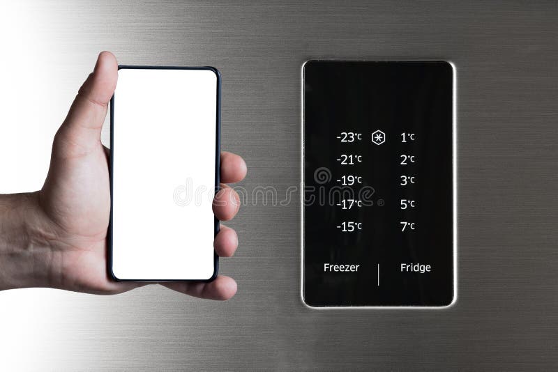 Hand Holding Frameless Smartphone Near Fridge and Freezer Control Panel ...