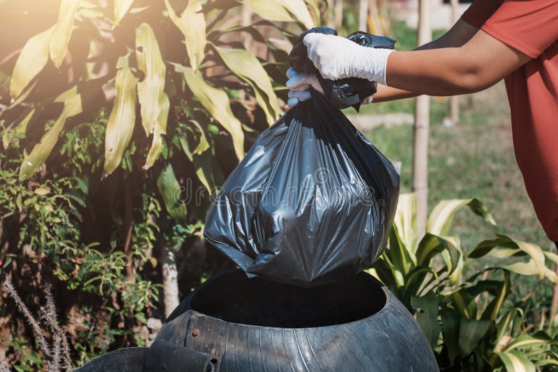 Hand Holding Garbage Bag Putting in To Trash Stock Image - Image of ...