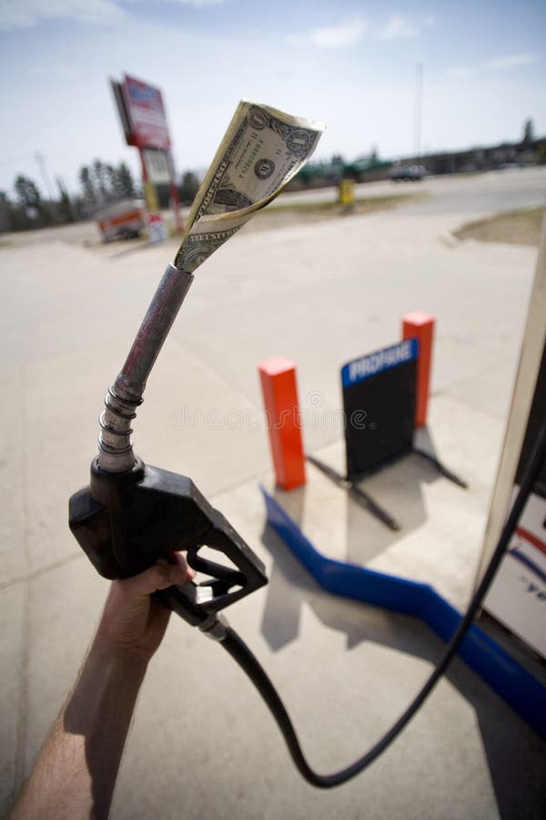 Gas Pump with Money in the Nozzle Stock Image - Image of fuel, road ...