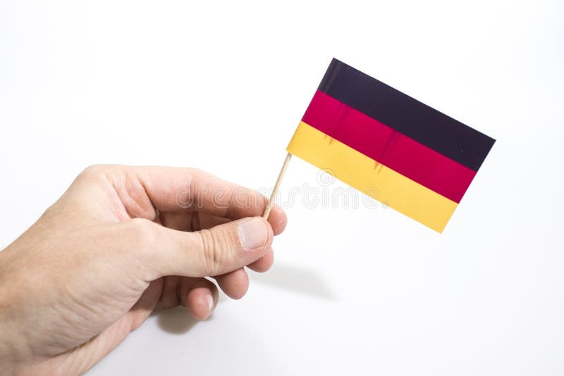 Hand is Holding German Flag in a White Background Stock Photo - Image ...