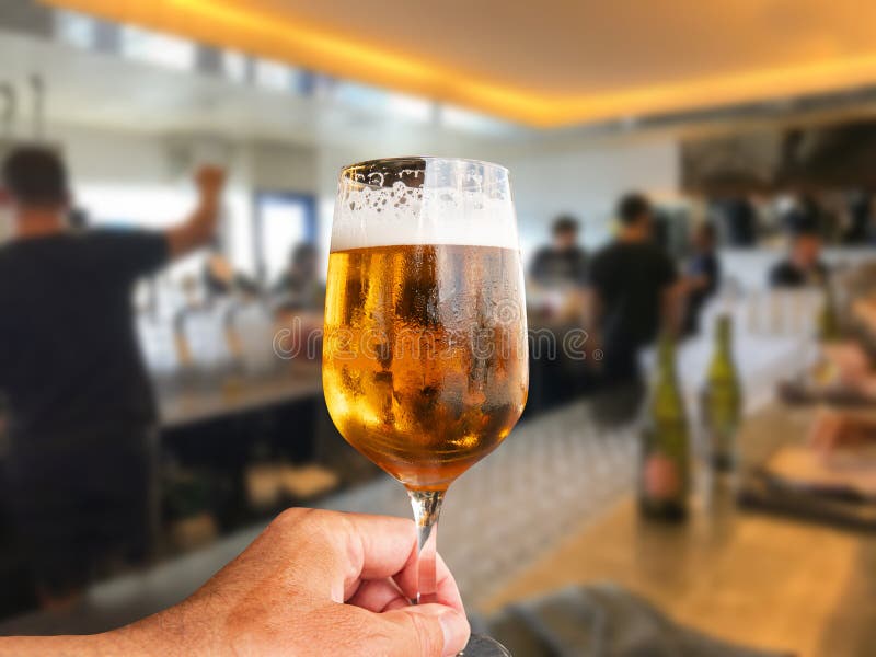 A Frothy Draft Beer in a Clear Glass, Emphasizing Its Golden Color and ...