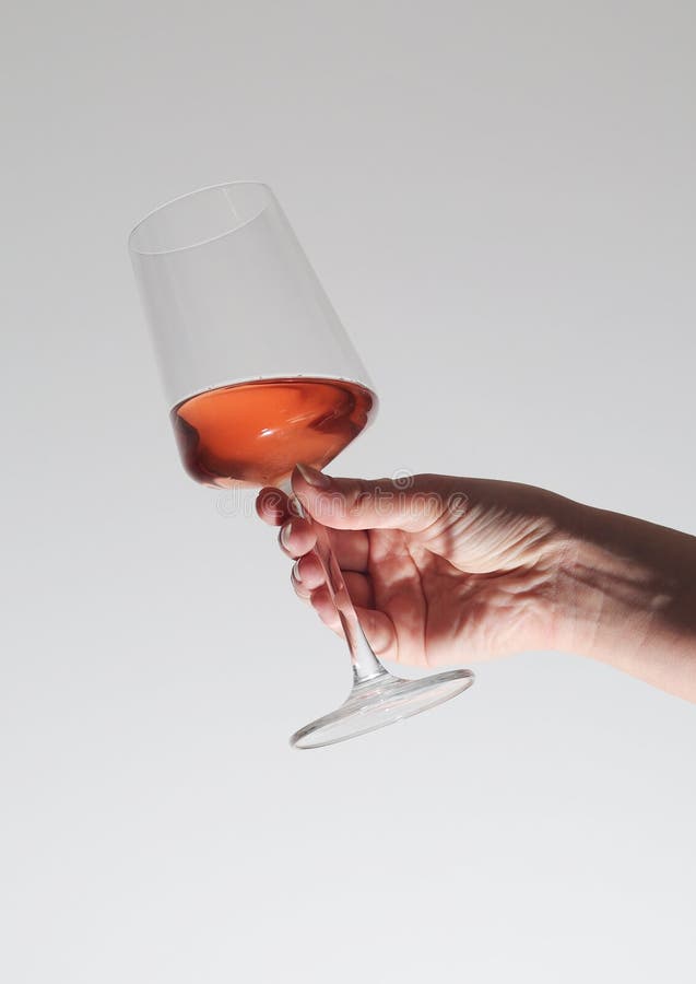 A Hand Holding a Glass with Rose Wine Stock Image - Image of alcohol ...