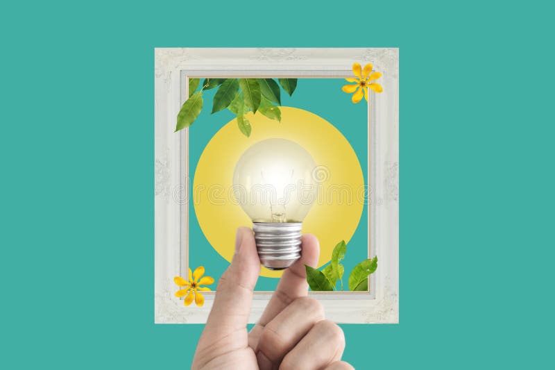 Hand Holding Glowing Light Bulb, with Natural Resources Abstract ...