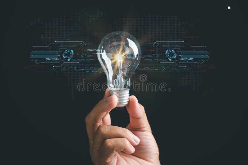 A Hand Holding a Glowing Light Bulb, Signifying the Connection between ...