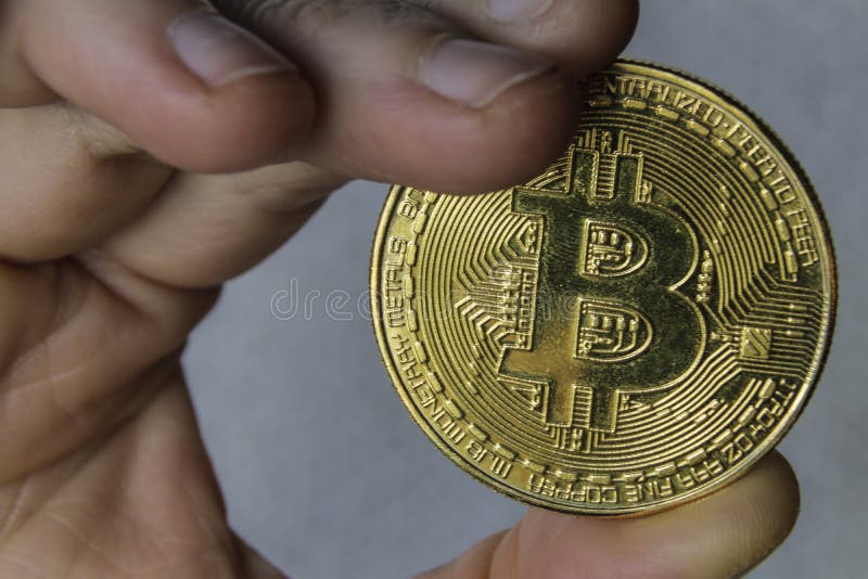 Hand Holding Gold Bitcoin Token Stock Photo - Image of concept ...