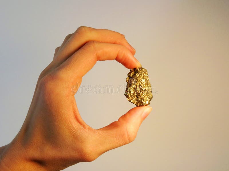Hand Holding Gold Nugget stock photo. Image of hand, mining - 40151638