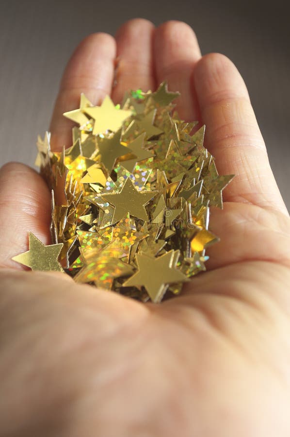 Hand Holding Gold Stars stock photo. Image of golden - 24537576