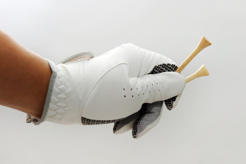 A hand holding golf tee stock photo. Image of hobby, leather - 19155226