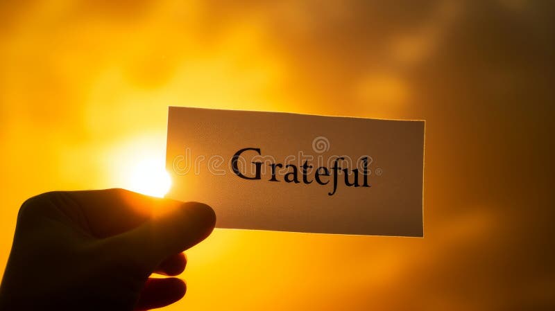Hand Holding "Grateful" Note at Sunset Stock Image - Image of ...