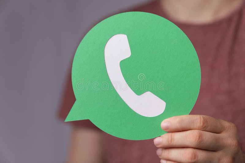 Hand Holding a Green Paper Phone Icon Stock Photo - Image of closeup ...