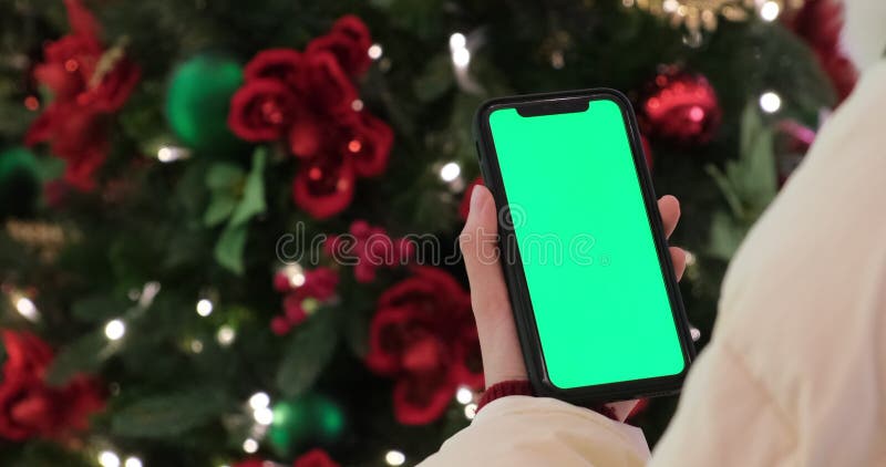 Hand Holding and Using Green Screen Smartphone at Christmas Night Stock ...