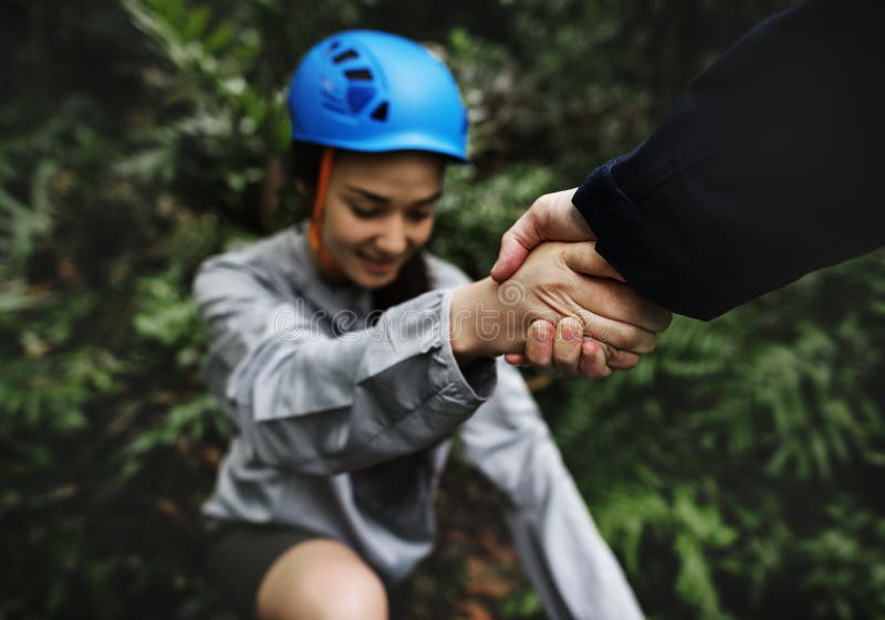 Hand Holding Hand Helping in Forest Stock Photo - Image of adventure ...