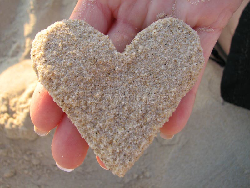 Hand Holding a Heart Made of Sand Stock Image - Image of closeup, heart ...