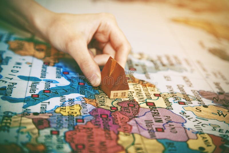 Hand Holding House on World Map Stock Photo - Image of couch, estate ...