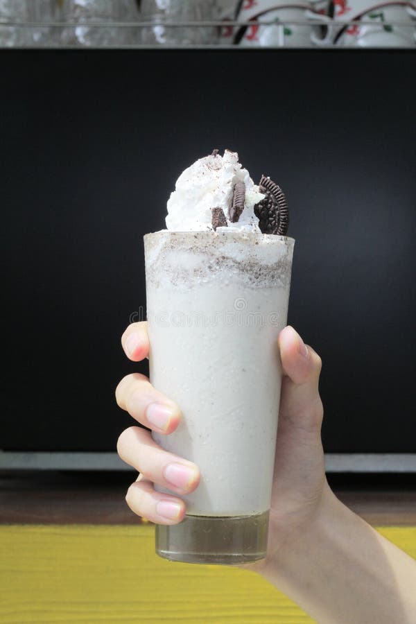 A Hand Holding Ice Cookies Oreo with Ice Cream Stock Image - Image of ...