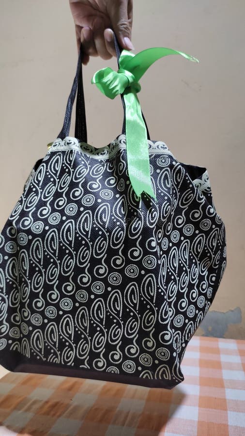 A Hand Holding Ied Parcel Bag, Ramadhan Gift Stock Photo - Image of ...