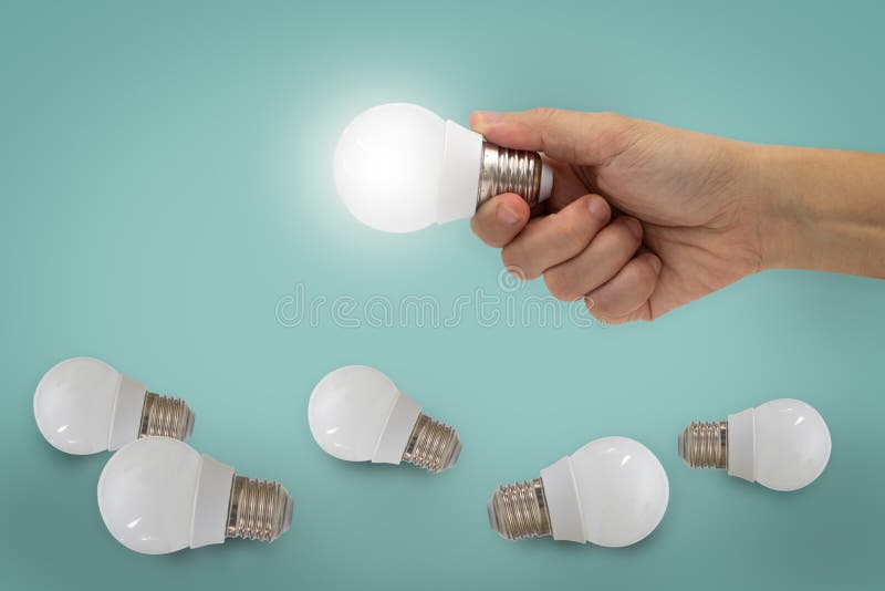 Hand Holding Illuminated Light Bulb, Idea, Inspiration Concept Stock ... Hand Holding Illuminated Light Bulb, Idea, Inspiration Concept Stock ...