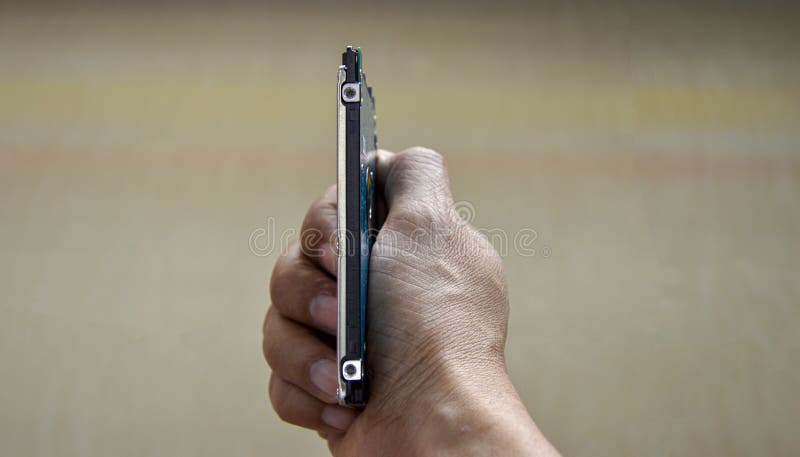 Hand Holding 2.5 Inch Hard Drive, Swivel Plate Type on the Side Stock ...