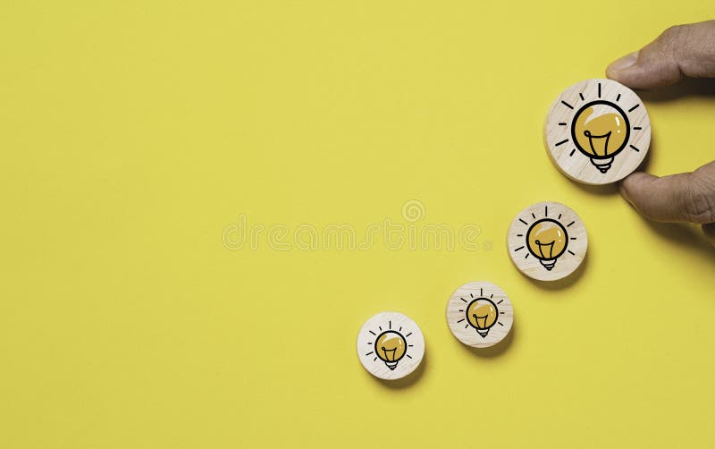 Hand Holding Increasing Biggest Glowing Lightbulb Icon for Enhance ...