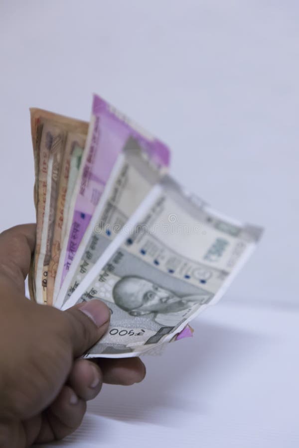 Hand Indian Rupee Notes Stock Photos - Download 447 Royalty Free Photos