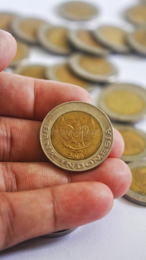 Hand Holding Indonesian Coins 2000 Stock Image - Image of finger, bank ...