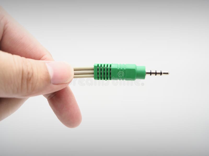 Hand Holding a Jack Instrument Cable on a White Background Stock Image ...