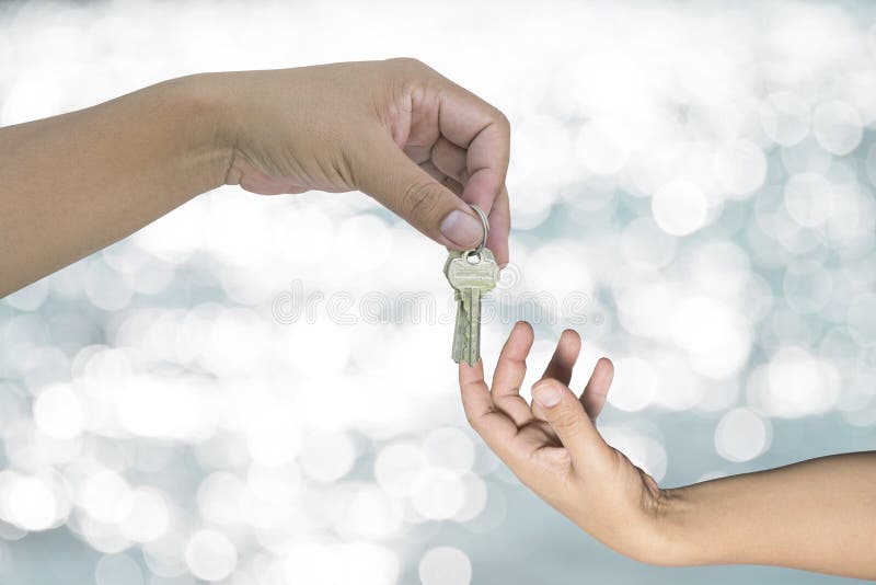 Hand holding key stock image. Image of giving, body, investment - 73500989