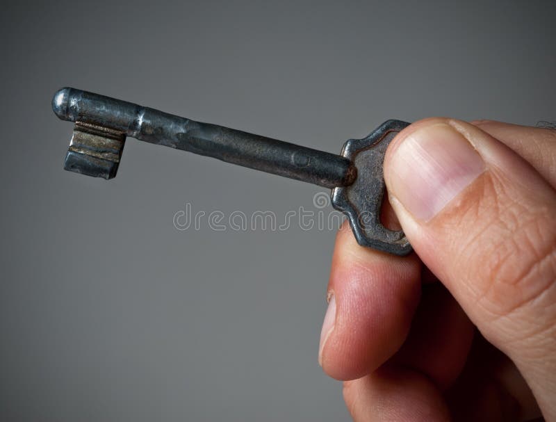 Key in hand unlock success stock photo. Image of gate, bottom - 581880