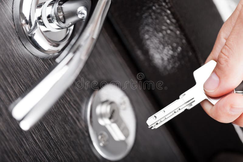 Hand Holding Key Opening Door Lock Stock Image - Image of keyhole ...