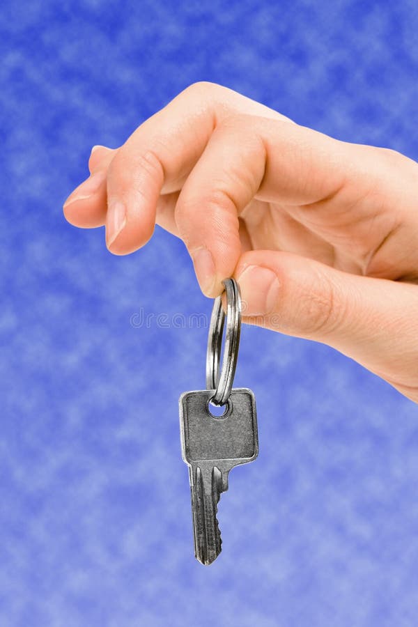 Hand Holding Key Over Blue Sky Stock Photo - Image of real, open: 5599436
