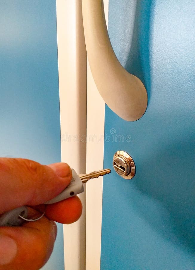 Hand Holding a Key and is about To Open a Lock. Stock Image - Image of ...