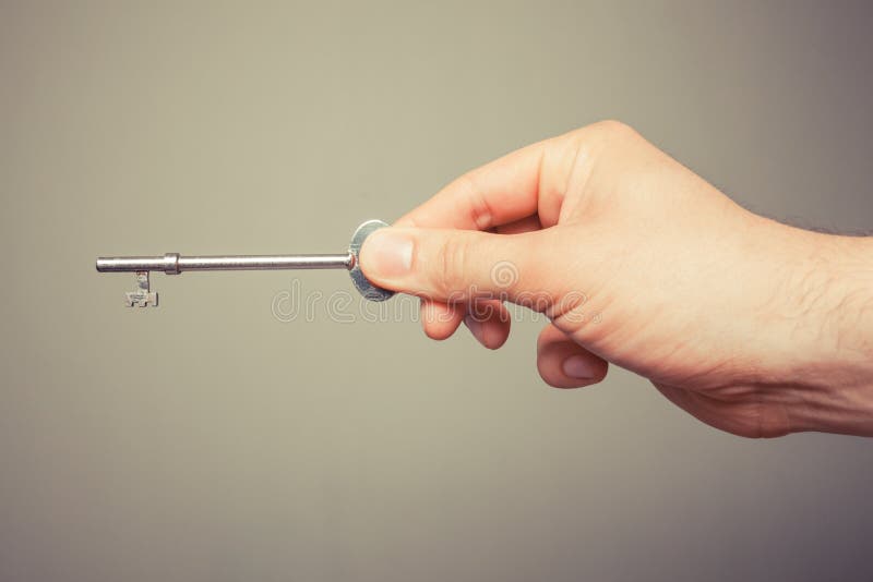 Hand holding a key stock image. Image of forescasting - 39949187