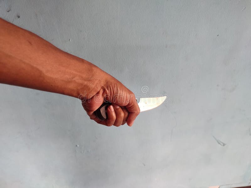 Hand holding knife stock photo. Image of wood, finger - 287557288