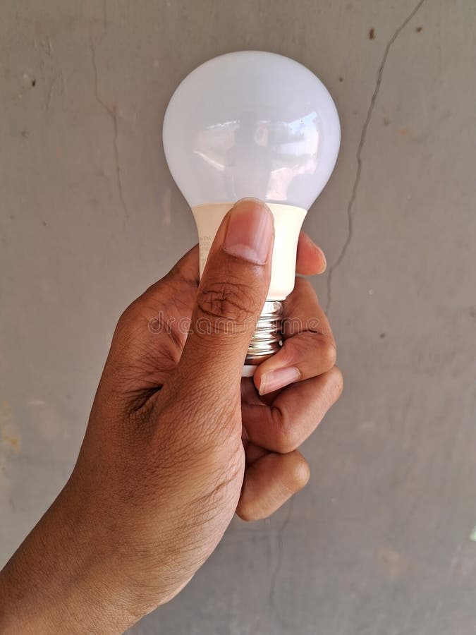 A Hand Holding a Led Lightbulb Stock Photo - Image of holding, hand ...