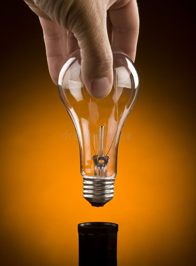 Hand Holding Light Bulb stock image. Image of bright - 11275995