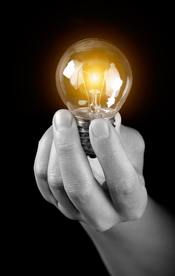 Hand holding light bulb stock photo. Image of good, inspiration - 15337702