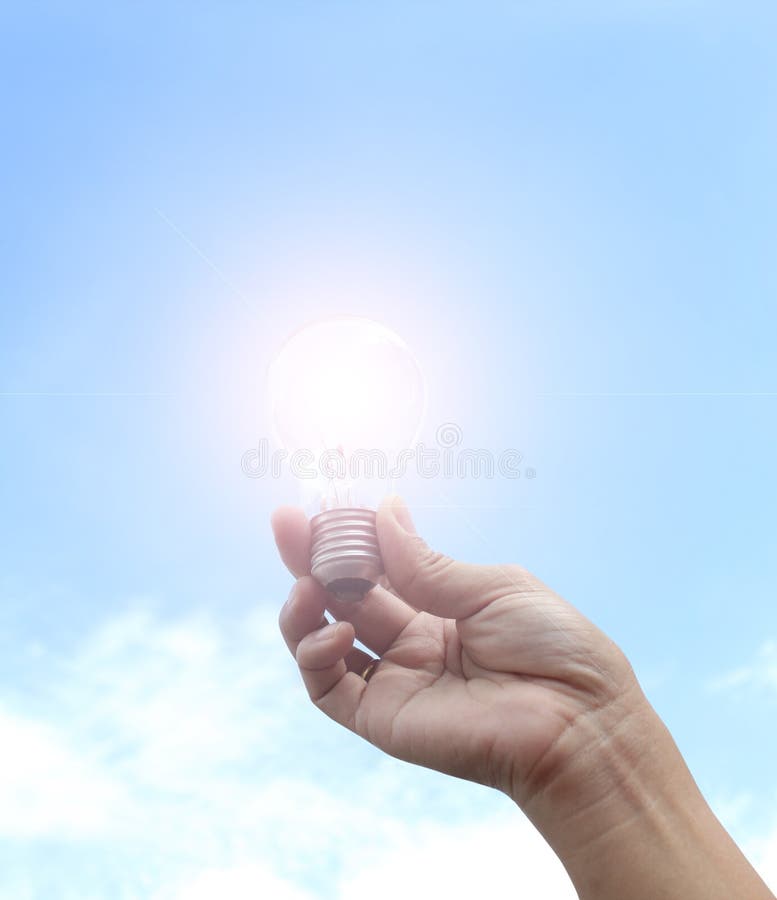 Hand holding light bulb stock photo. Image of discovery - 20594042