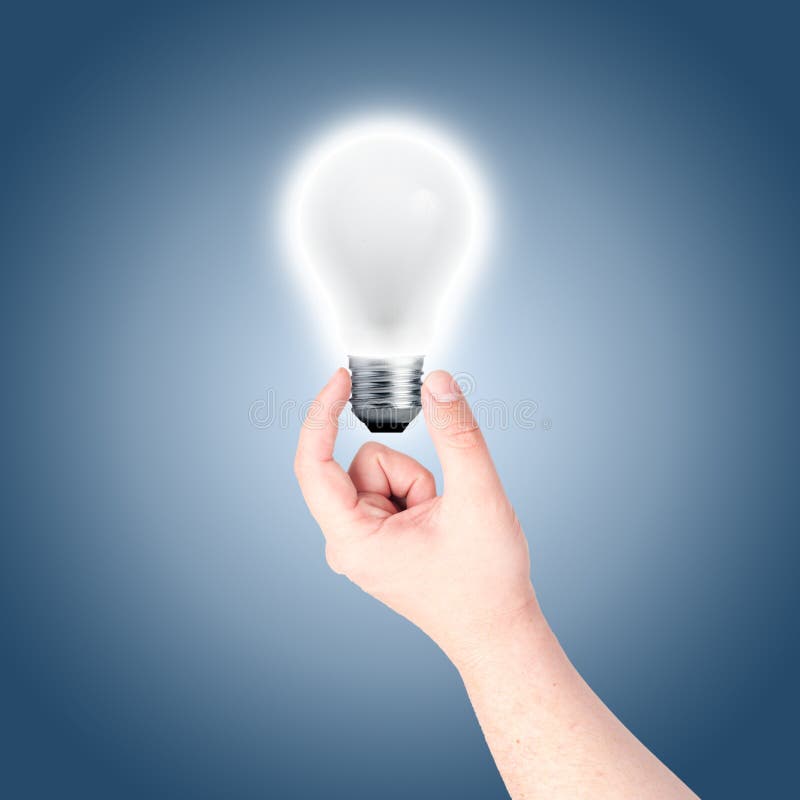 Hand holding light bulb stock photo. Image of glowing - 27926556