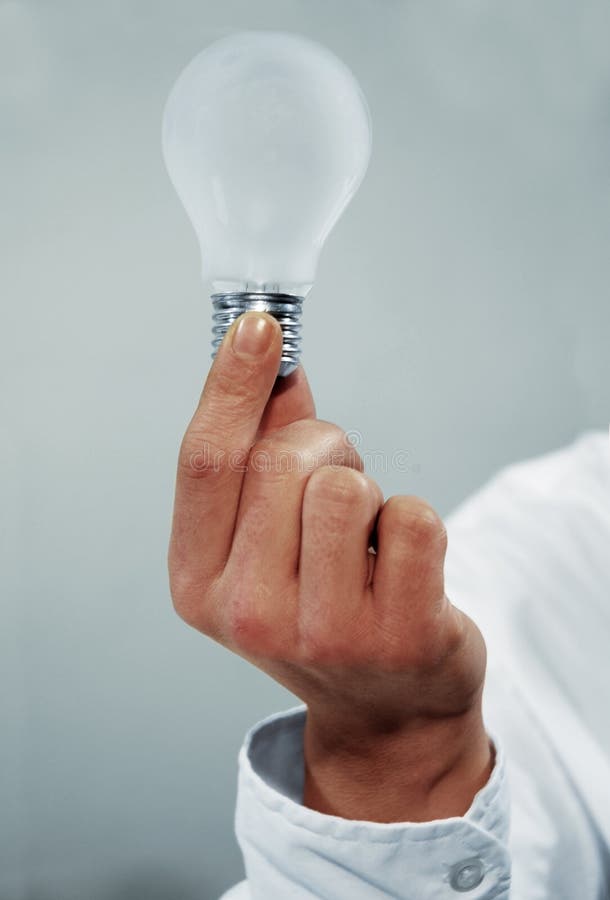 Hand holding light bulb stock image. Image of electricity - 3994119